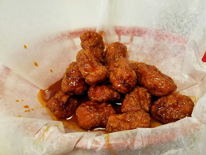 These boneless wings aren't messing around—glazed with sauce that walks the perfect line between sweet and heat, they're finger food worth getting your fingers sticky for.