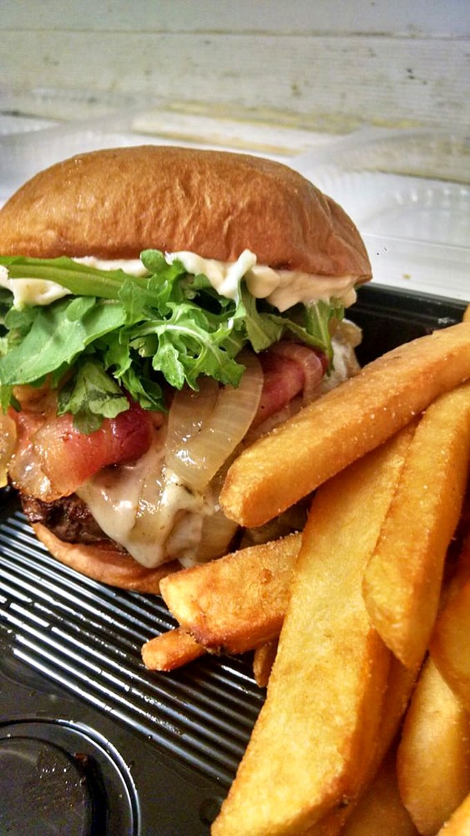 This isn't just a burger—it's a towering achievement of beef, bacon, and melty cheese that makes fries seem like an afterthought (they're not).