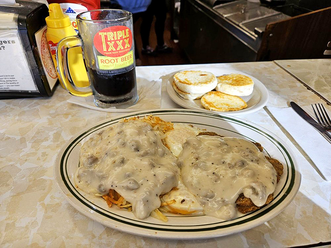 Chicken fried steak swimming in gravy so good you'll want to write it love letters. The biscuits are just there to soak up the romance.