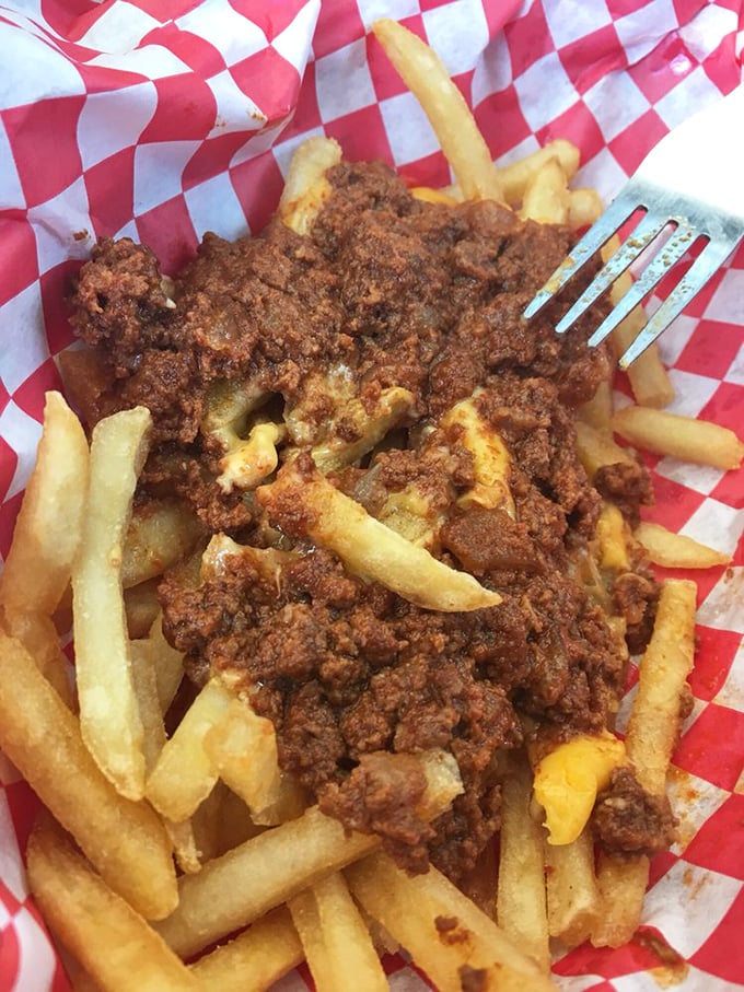 Chili cheese fries: where utensils become mandatory and napkins are counted by the dozen.