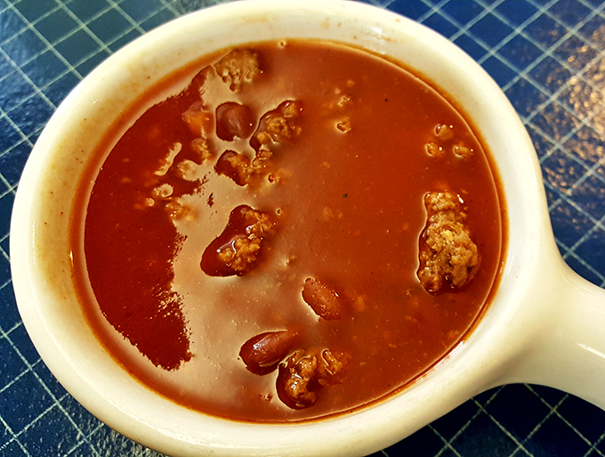 Chili that respects the ancient pact between beans, meat, and tomato—a warm hug in a ceramic vessel for those cold Illinois afternoons.