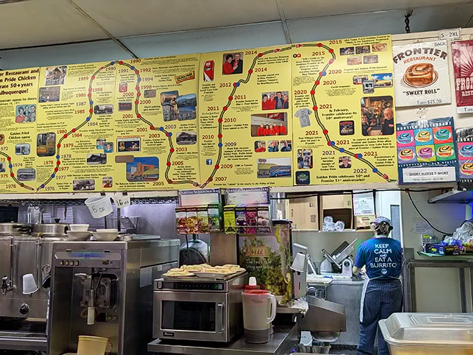 The timeline wall tells Frontier's story while staff orchestrate the breakfast ballet—a choreography of spatulas and smiles.