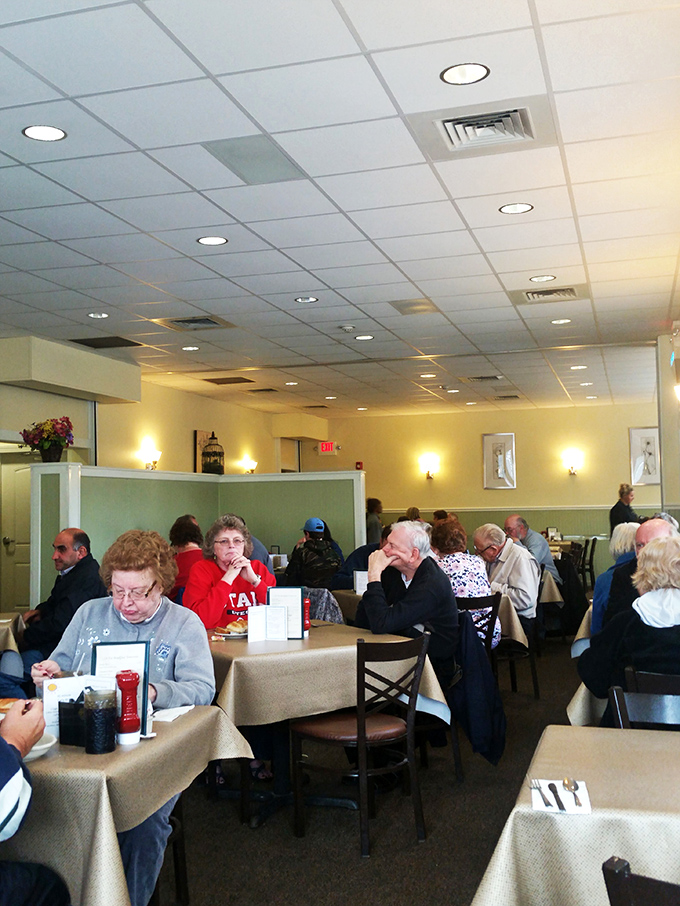 The counter serves as command central, where friendly staff orchestrate the ballet of comfort food that keeps locals and travelers coming back.