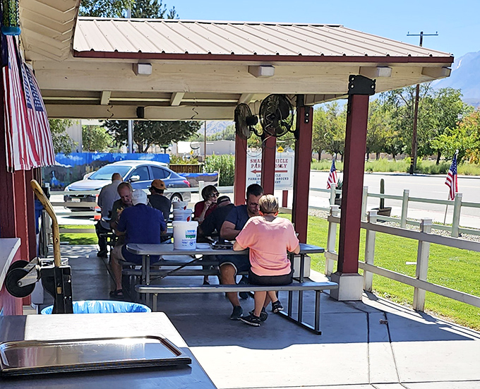 The covered patio offers respite from the Eastern Sierra sun, where strangers become friends united by the universal language of "mmm" and "pass the sauce."