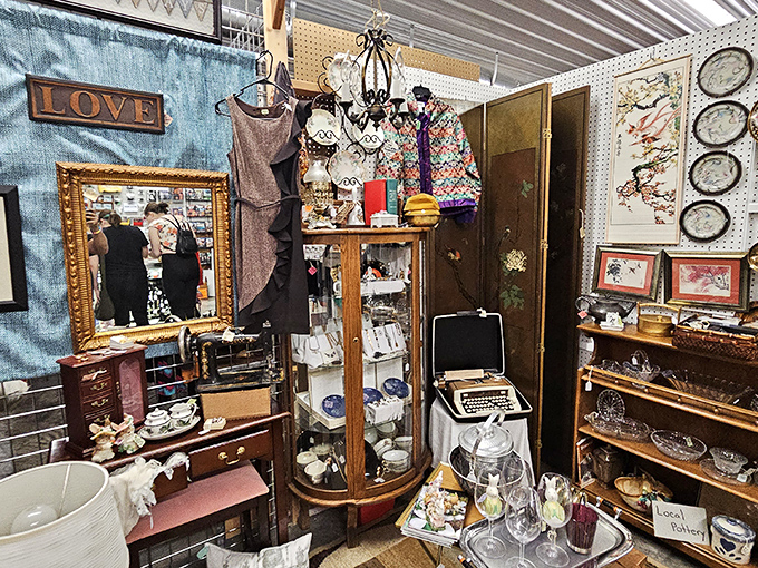 The word "LOVE" watches over this eclectic booth where every item – from mirrors to typewriters – awaits its second chance at usefulness.