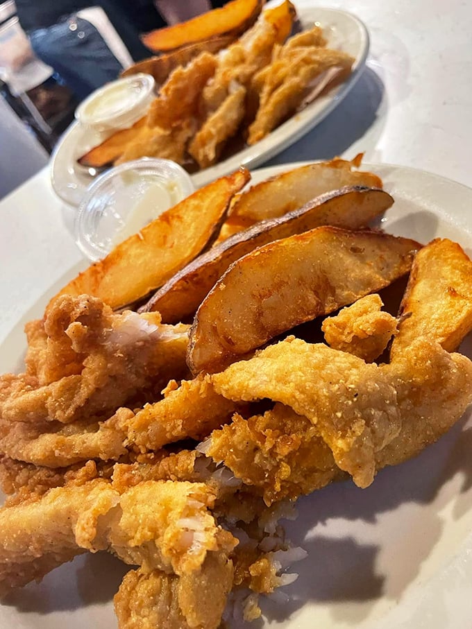 Golden fish and steak fries that shatter with each bite – the kind of simple perfection that makes you question fancy dining altogether.