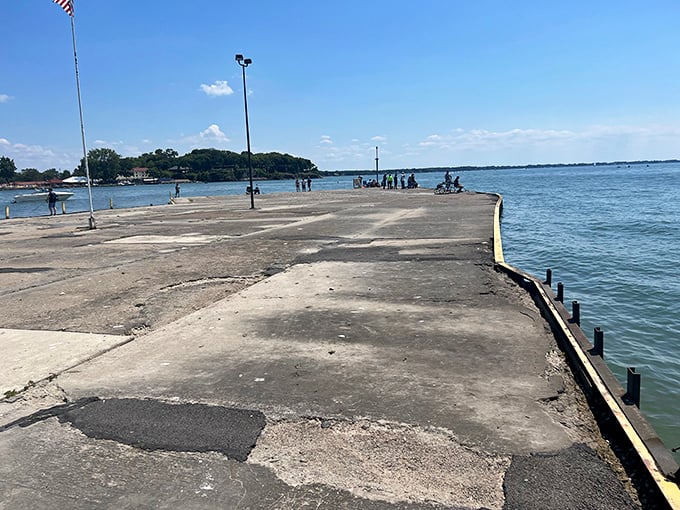 The weathered fishing pier tells silent stories of "the one that got away" while offering front-row seats to Lake Erie's ever-changing moods.