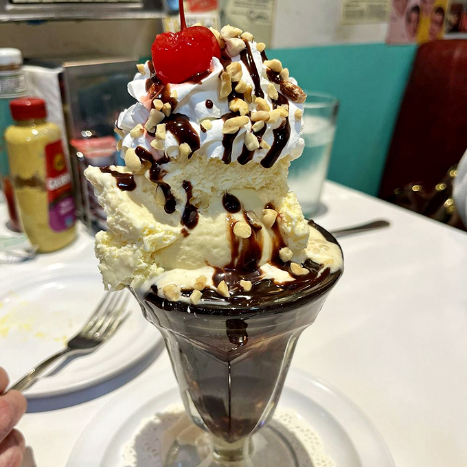 This isn't dessert—it's architecture. A towering monument to the days when calories were just numbers nobody counted.
