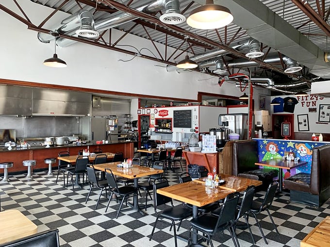 High ceilings, open kitchen, and enough space between tables to keep your breakfast conversation private. Diner architecture at its most practical.
