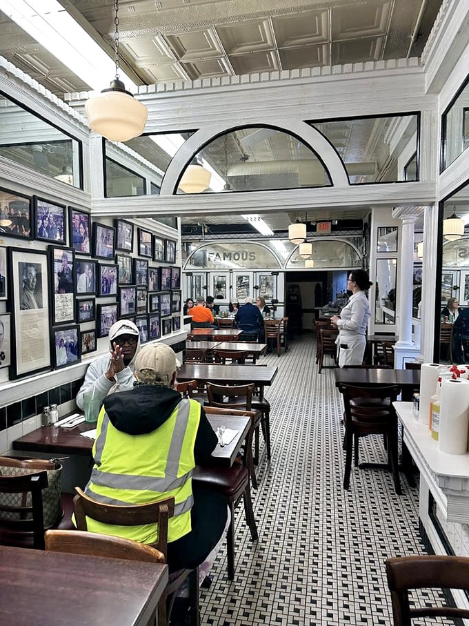 Photos tell the deli's history while diners make memories of their own. The century-old tradition of eating well continues beneath that stunning ceiling.