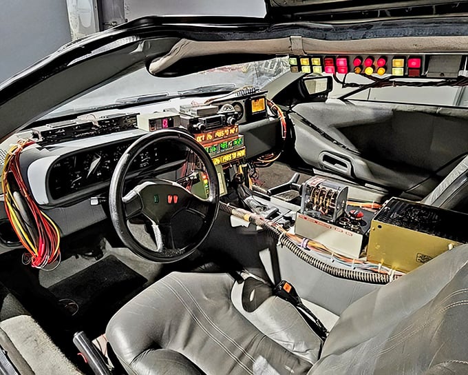 The DeLorean's cockpit—where 1980s tech meets time-travel dreams. Great Scott, those wires could jumpstart a conversation with any movie buff!