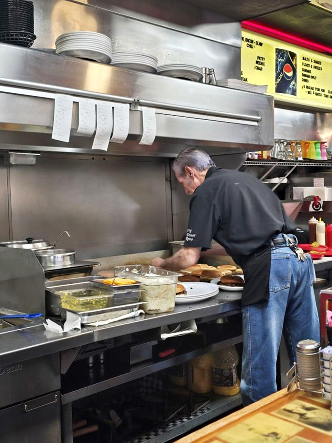 The kitchen ballet—where short-order cooking becomes performance art and every spatula flip is applause-worthy.
