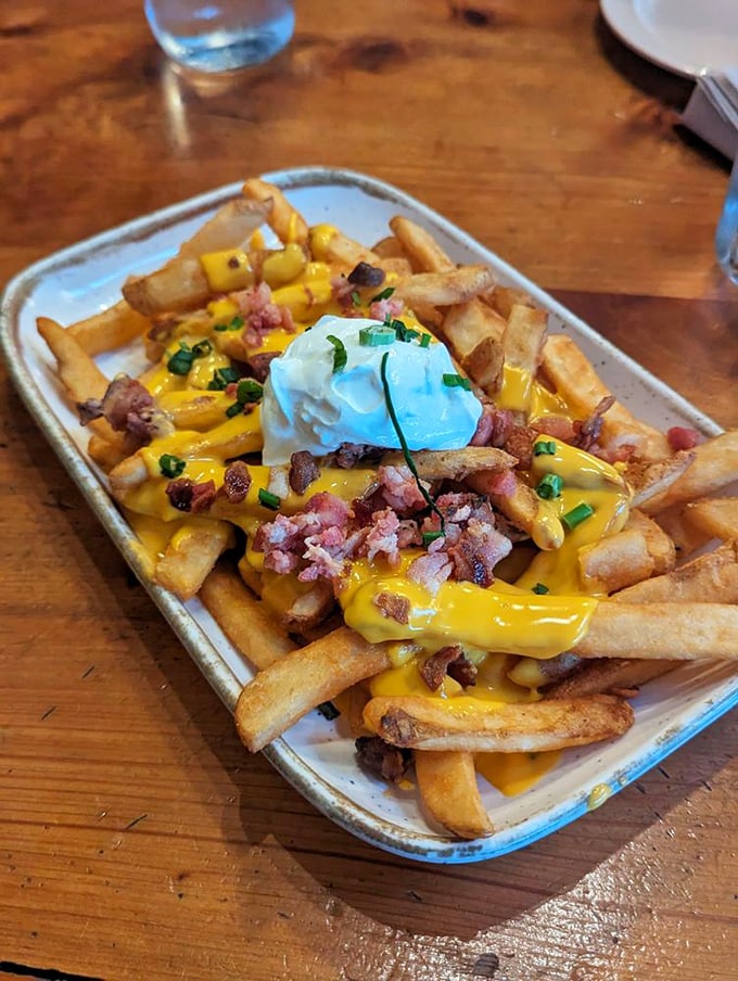 Loaded fries that make French cuisine seem unnecessarily complicated. Cheese, bacon, and sour cream—the holy trinity of comfort food.