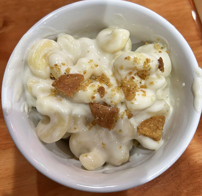 Mac and cheese that makes you understand why comfort food got its name. Those crispy bits on top are little nuggets of genius.