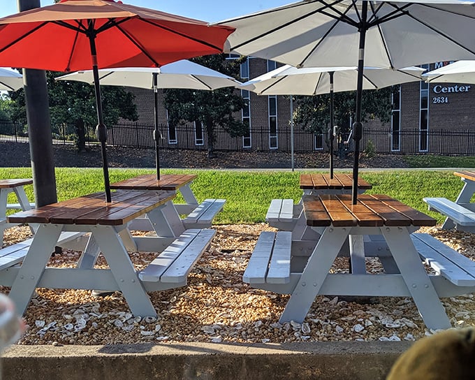 Outdoor picnic tables under cheerful umbrellas invite you to enjoy seafood in the sunshine. Al fresco dining, North Carolina style.