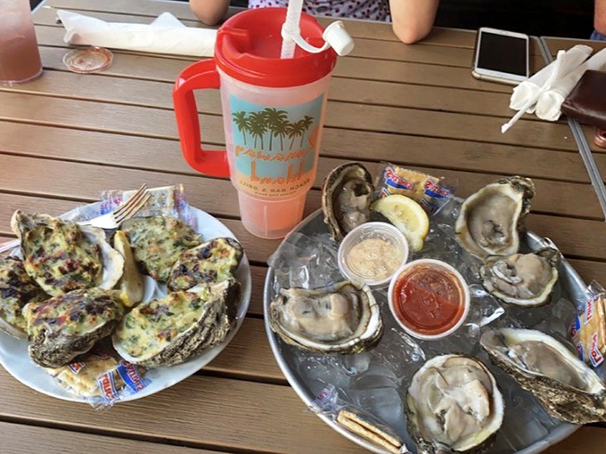 Fresh oysters and Rockefeller-style bivalves—nature's perfect appetizer paired with that signature "Life is Short. Run Away" philosophy.