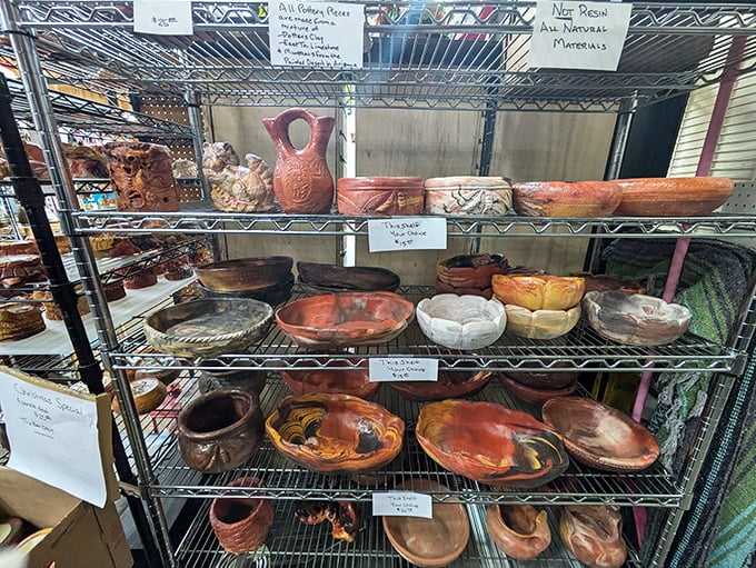 Pottery with personality lines these metal shelves. Each earthen bowl tells a story of Appalachian craftsmanship and artistic tradition. 