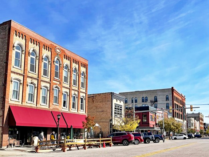 These historic storefronts with their bright awnings aren't just buildings—they're incubators for small businesses where shopkeepers still remember your name.