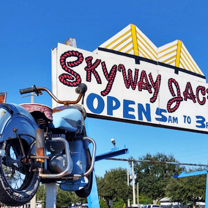 A vintage sign and classic motorcycle announce your arrival at breakfast paradise. Early birds get the omelets from 5am to 3pm.