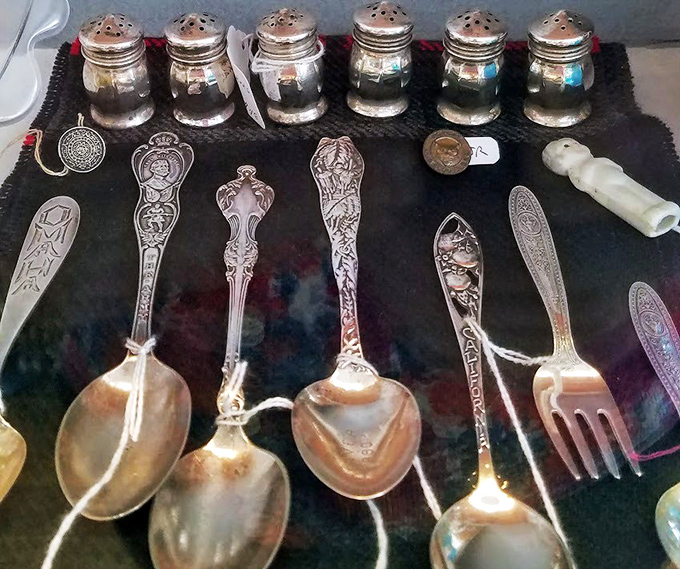 Silverware that's lived enough life to write memoirs—each ornate handle pattern tells a story of Sunday dinners and holiday gatherings long past.