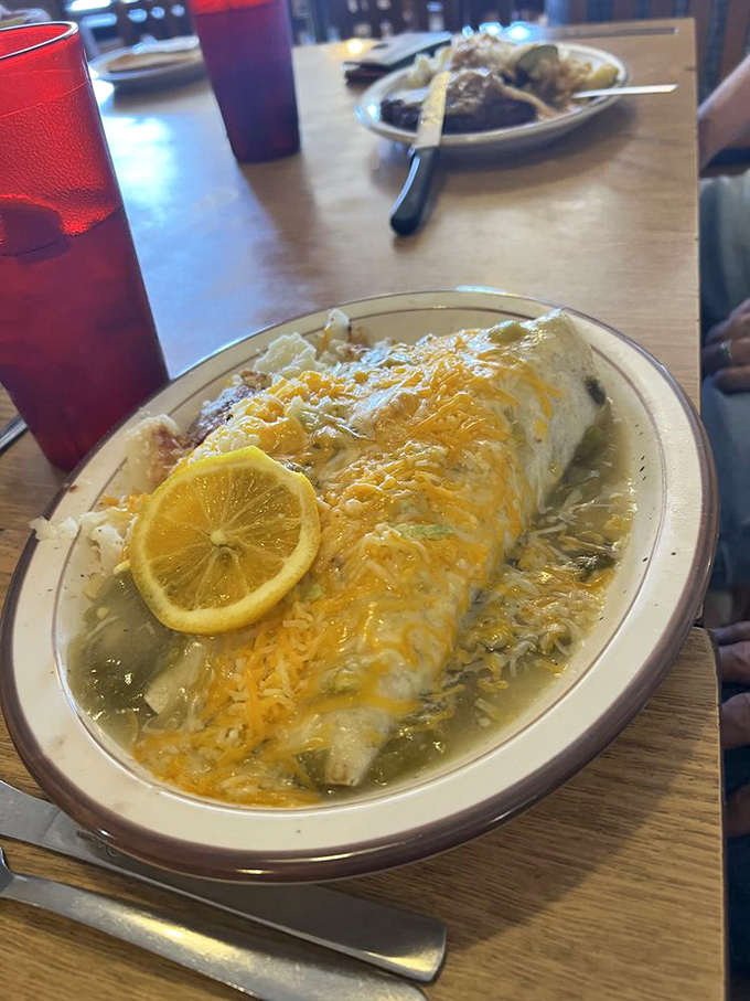 This isn't just a breakfast burrito—it's a sleeping bag of cheese and green chile that your taste buds want to camp in forever.