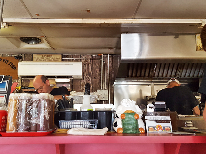 The open kitchen view—where breakfast dreams come true and the staff moves with the practiced choreography of people who know their craft.