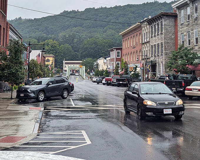 Even on rainy days, Shelburne Falls maintains its Norman Rockwell charm—just add umbrellas and a glistening Main Street.