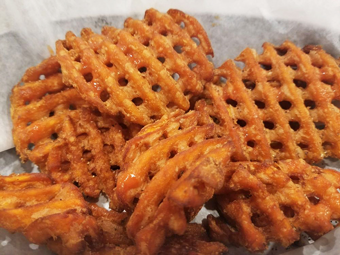 These aren't just any sweet potato waffle fries—they're crispy, latticed works of art that somehow improve on potato perfection.