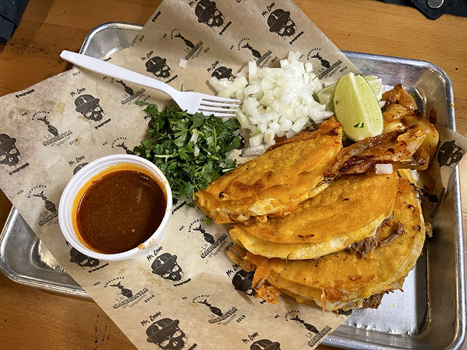 These tacos aren't just served—they're presented with pride. The chopped onions and cilantro are like confetti for your taste celebration.