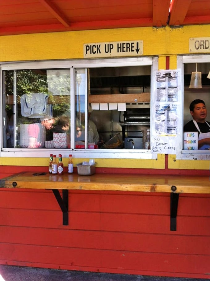 The takeout counter – where dreams come true in paper-wrapped packages and friendly faces make waiting a pleasure, not a chore.