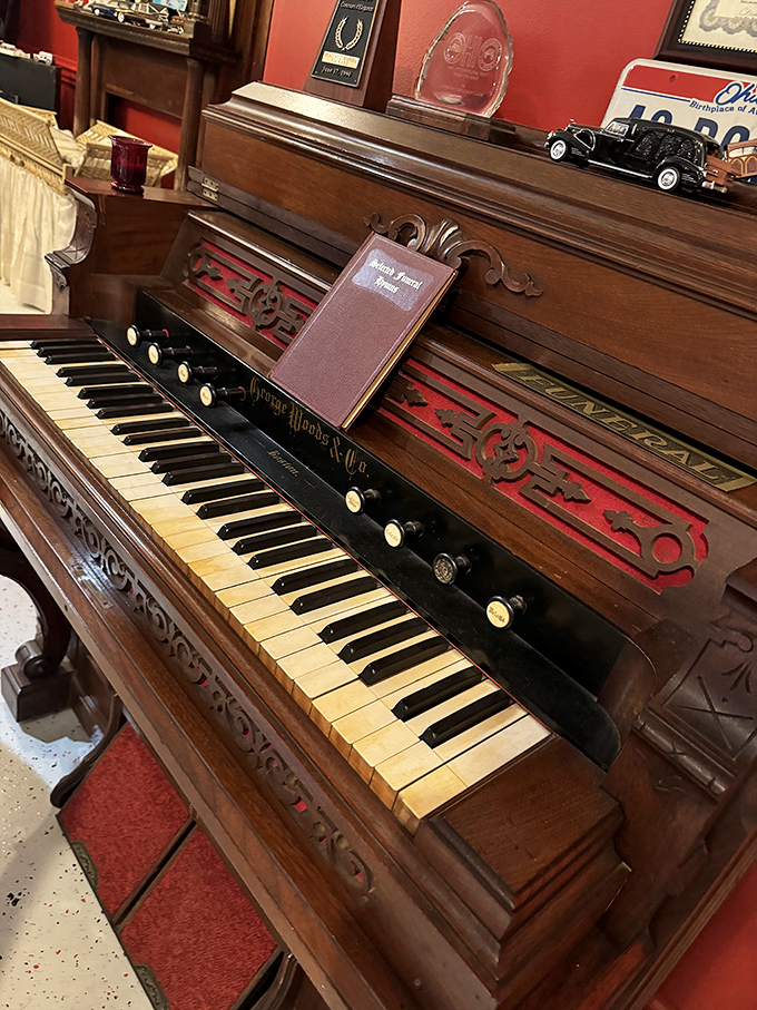 This beautifully preserved pump organ once provided the soundtrack to grief—its wooden keys having accompanied countless souls on their final journey.