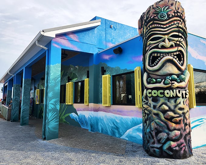 That tiki statue has seen things – mostly happy hours that started at noon and ended under stars.