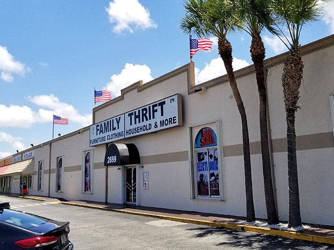 Family Thrift's no-nonsense exterior with American flags proudly waving – patriotic bargain hunting at its finest!