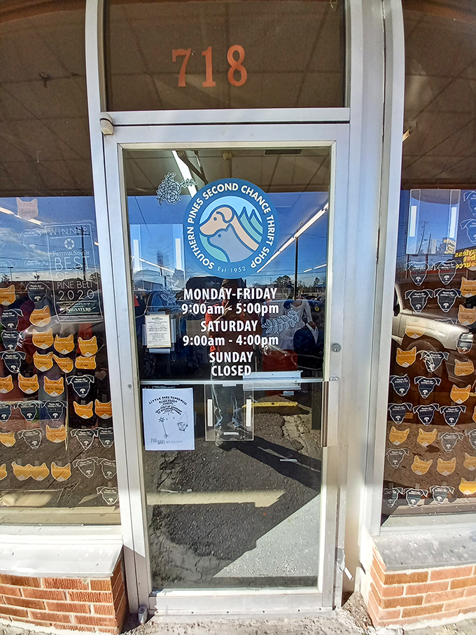 Southern Pines Second Chance Thrift Shop's door displays more than just hours—it's a portal to guilt-free retail therapy that helps animals.