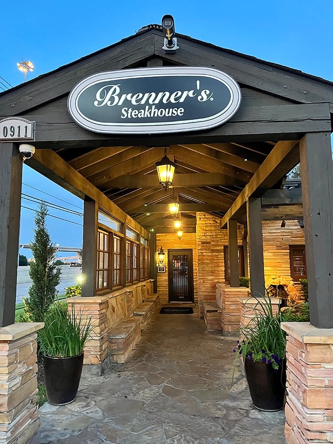 Evening lights transform Brenner's into a glowing sanctuary where steak is the religion and everyone's a believer.