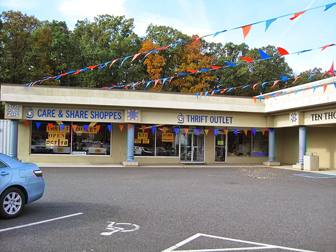 Festive flags flutter above Care & Share like a permanent celebration of secondhand scores and sustainable shopping.