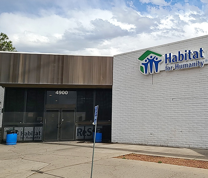 The ReStore parking lot is where renovation projects begin. Those waiting cars belong to people who know where to find affordable home treasures. 