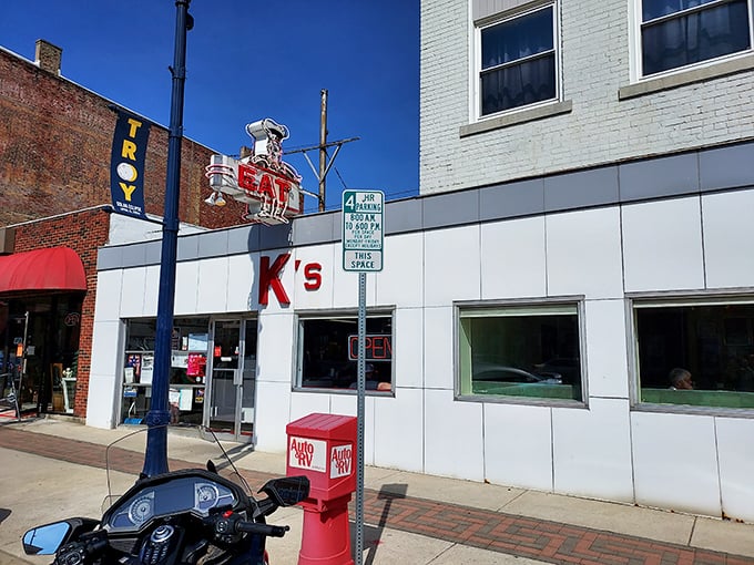 K's white tile exterior with simple red lettering – minimalist before it was cool, delicious since day one.