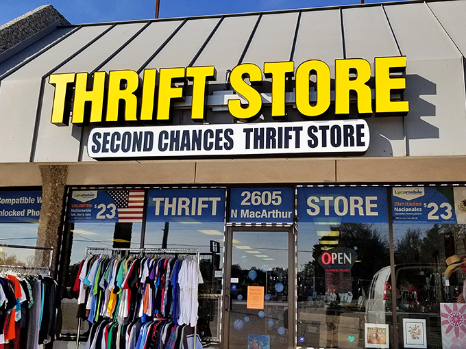 Bold yellow letters announce this thrifting destination with confidence. The name speaks truth—everything inside deserves its second chance at usefulness.