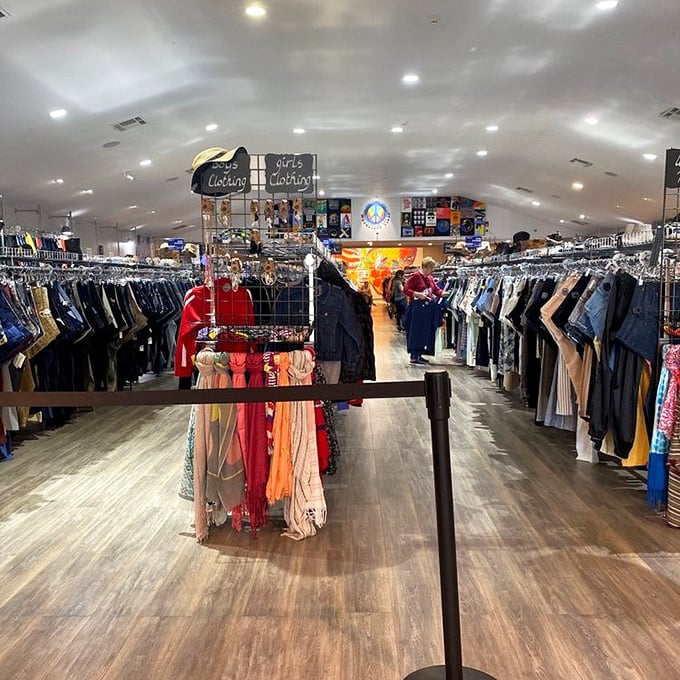 Inside this retro paradise, clothing racks create narrow pathways of discovery—like walking through a fashion time tunnel.
