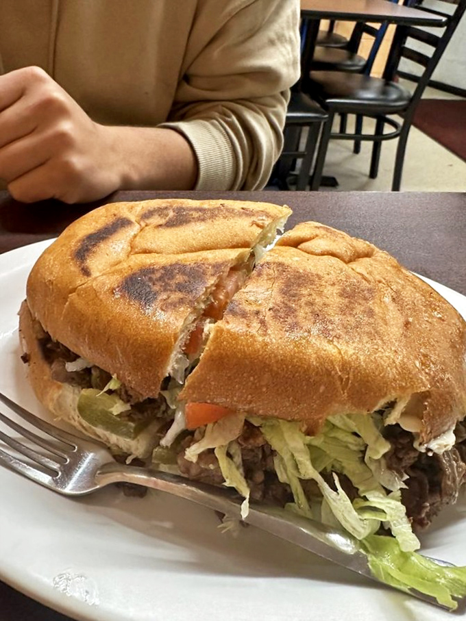 Not all heroes wear capes—some come in bread form. This torta, packed with seasoned meat, fresh veggies, and just enough sauce, is sandwich perfection.