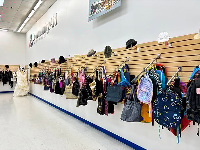 The accessories wall—where handbags and backpacks hang like fashionable fruit, ripe for the picking at prices that seem like typos.