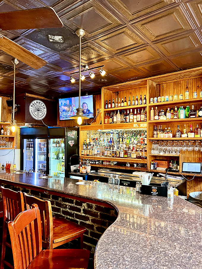 The bar at Hyman's isn't just well-stocked—it's a liquid library with enough options to write your own happy ending.