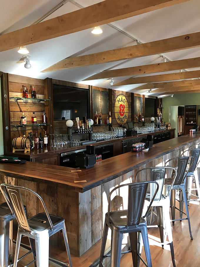 A bar built for lingering, where the wood-and-metal aesthetic says "we're serious about our drinks" but the atmosphere says "stay awhile."