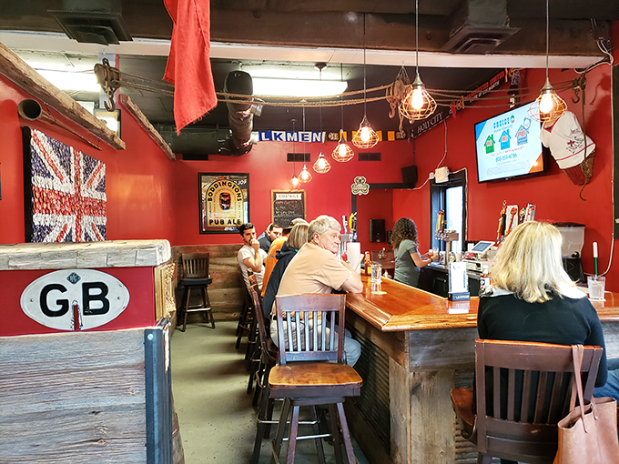 The bar area glows with British pride, from the Union Jack to the GB sign—a corner of England carved out in the American South.