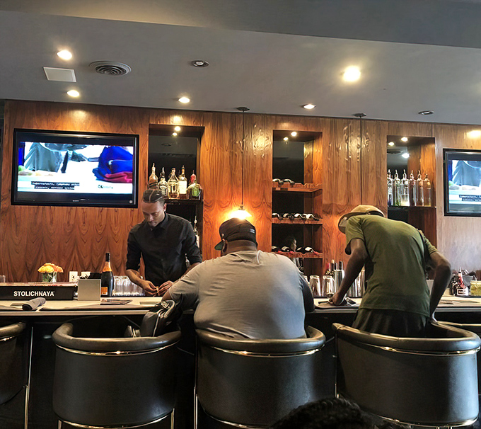 The bar area – where seafood stories are shared and cocktails flow. A wood-paneled sanctuary for crab cake enthusiasts.