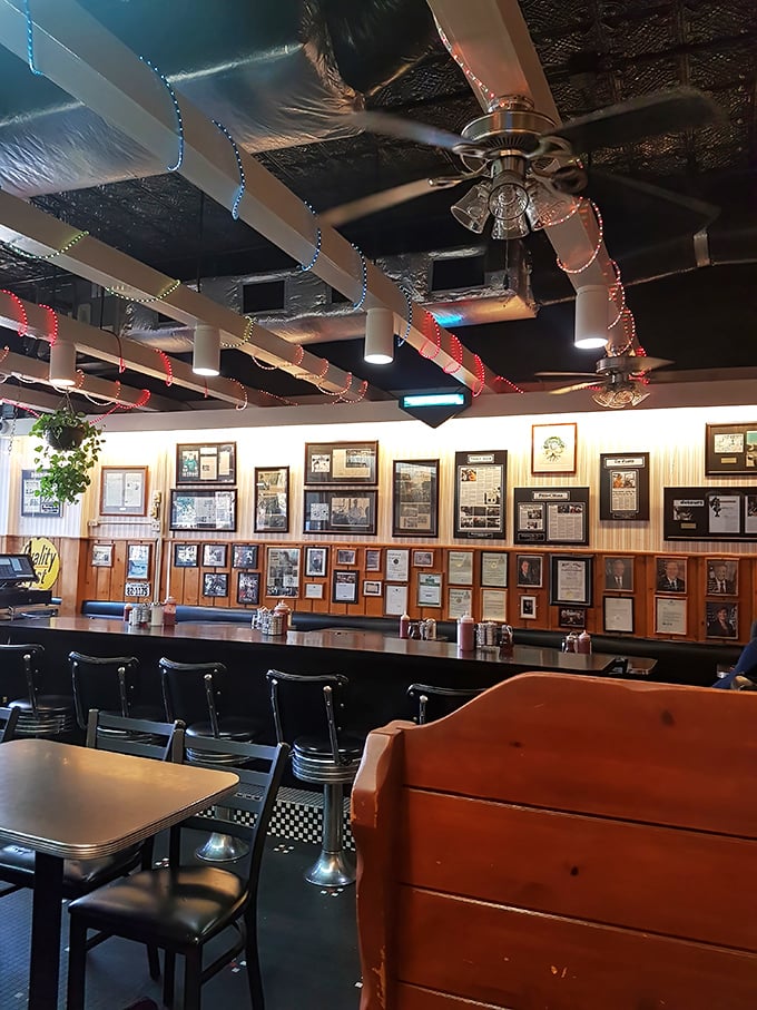 The counter where regulars have worn their own grooves into the seats. Notice the wall of fame – this place has fed everyone from college freshmen to presidential hopefuls.
