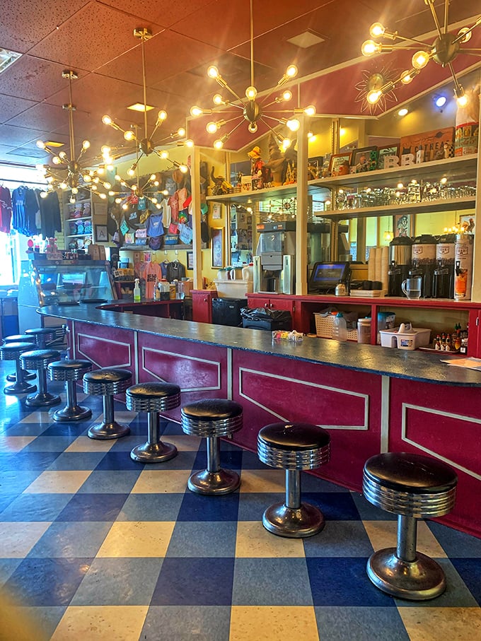 The counter where breakfast magic happens—classic diner stools invite you to perch and watch the morning show unfold.