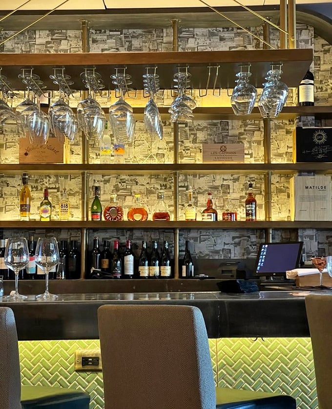The bar doesn't just serve drinks—it showcases them like the liquid jewelry they are. Those illuminated bottles are basically a beacon for sophistication.