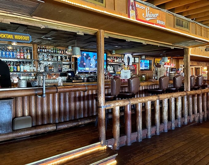The saloon-style bar invites you to belly up and enjoy a drink while waiting for culinary magic.
